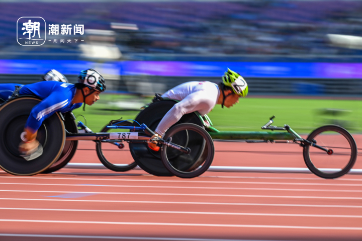 亚残运田径赛首日：轮椅竞速 风驰电掣